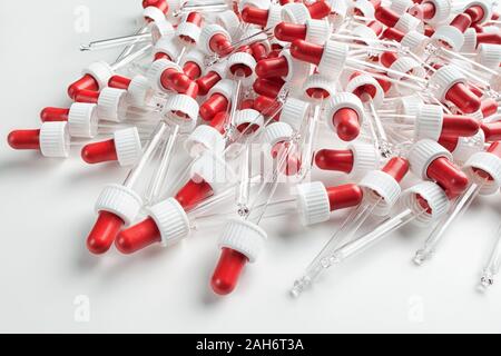 Transparent pipettes with a red bellow on a white background Stock ...