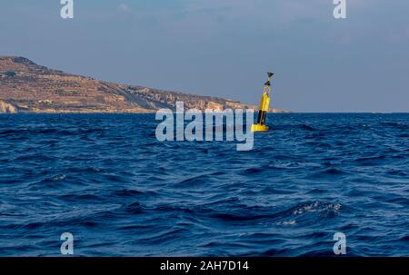 Navigational floating buoy - West cardinal mark - in Mediterranean sea ...