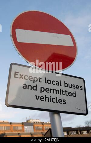 no entry sign with qualifying sign reading except local buses and ...