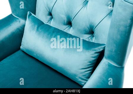 close up view of elegant velour blue armchair with pillow Stock Photo ...