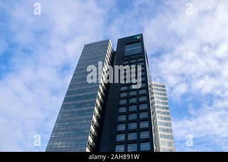 A logo sign outside of the headquarters of ABN AMRO Bank N.V. in ...