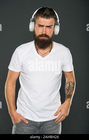 Modern music genre. Bearded man listen and sing to modern song. Modern ...
