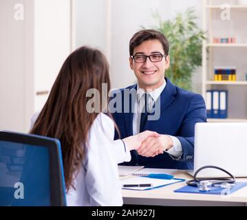 The businessman discussing health issues with doctor Stock Photo - Alamy