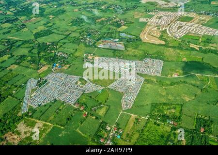 Aerial view showing expansion of urbanization and mass housing into ...