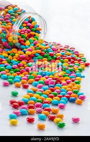 Jelly sweets spilling out of a red and white striped sweetie bag Stock ...