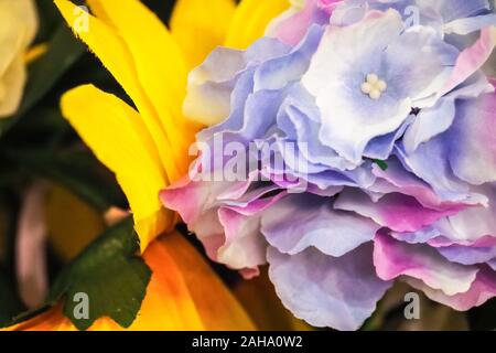 Colorful silk artificial flowers background Stock Photo - Alamy