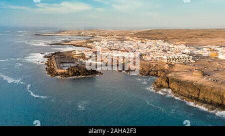 Aerial view of El Cotillo town harbour with beautiful coastline and ...
