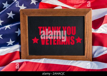chalkboard with thank you veterans illustration on american flag with ...