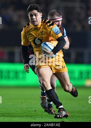 Wasps' Jacob Umaga evades the tackle of Bristol Bears' Jake Woolmore to ...