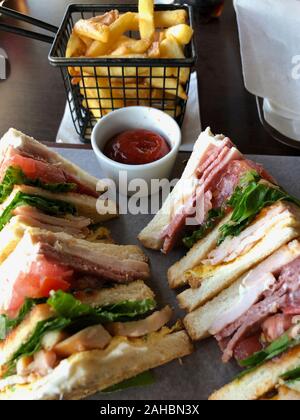 Club sandwich BLT with chips Stock Photo - Alamy