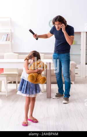 Angry father talking with daughter about scared boyfriend sitting on a ...