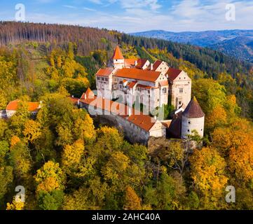 Medieval castle of Pernstein on a hill in the forest. South Moravian ...