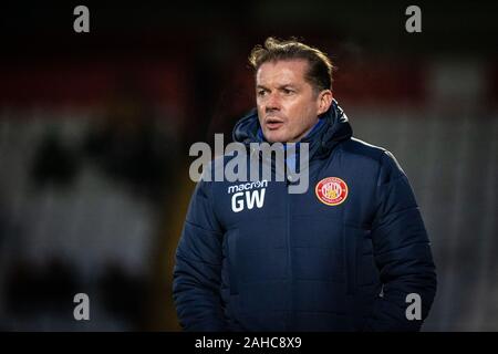 Football coach Graham Westley standing pitch side during match whilst ...