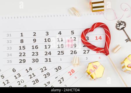 Valentine's Day background, date February 14 on calendar, flat lay, top ...