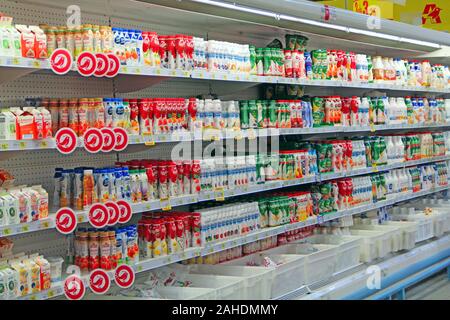 yogurt and others dairy produce on the shelves of shop Stock Photo - Alamy