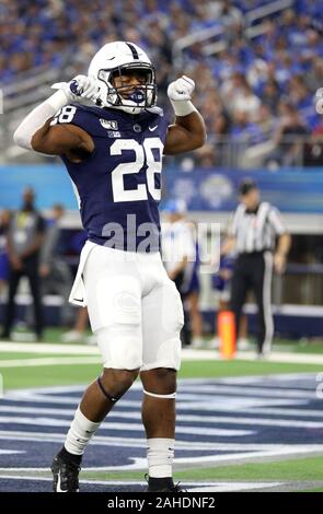 Penn State running back Devyn Ford (28) pushes off Maryland linebacker ...