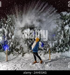 A person throwing hot water into the subzero cold air in Harbin, China ...