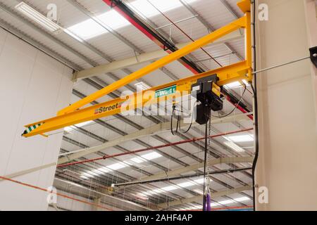 Overhead cranes inside industrial building. Bridge cranes inside hangar ...