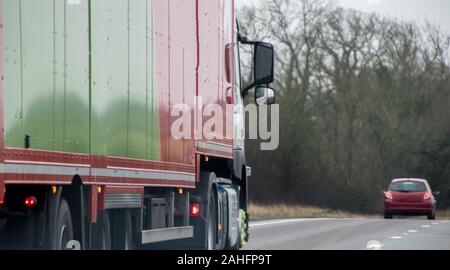 A large HGV travels across country to deliver or collect goods for the ...