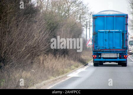 A large HGV travels across country to deliver or collect goods for the ...