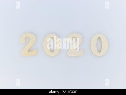 top view of white 2020 numbers near Christmas baubles on light blue ...