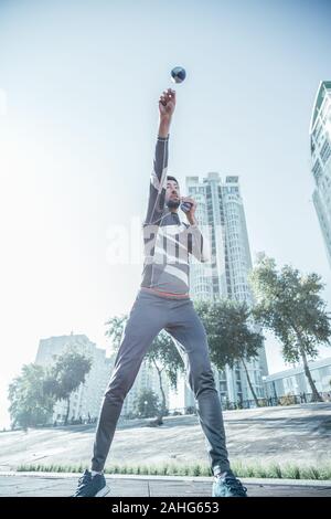 Emotional millennials jumping in the air on studio backgrounds, collage ...