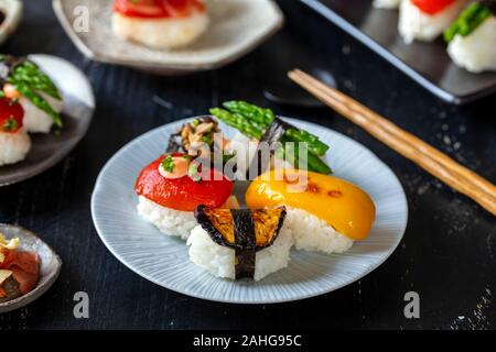 Vegan sushi with tomato, mushroom and aubergine Stock Photo - Alamy