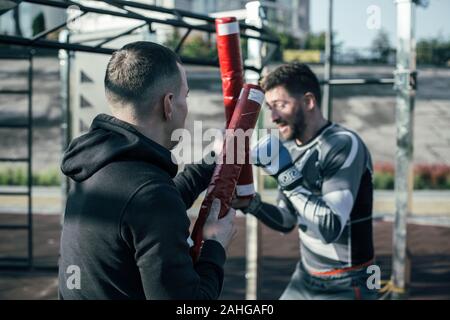 Boxing man ready to fight. Boxer with strong hands and clenched fists ...