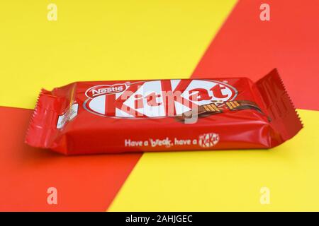 NY, USA - DECEMBER 4, 2019: Kit Kat chocolate bars in red wrapping lies ...