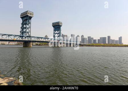 Haimen vertical lift bridge over the Haihe river in Tianjin's eastern ...