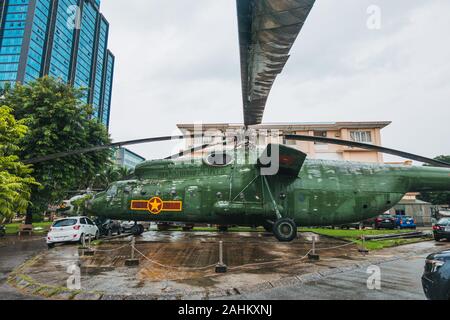 A huge Mil Mi6 Hook-A military transport helicopter dwarfs cars in the ...