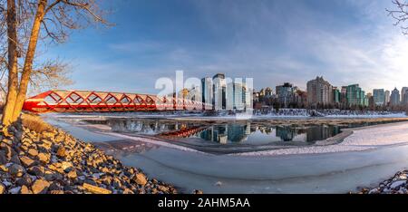 Night view of Calgary's Peace Bridge. The bridge features a red and ...