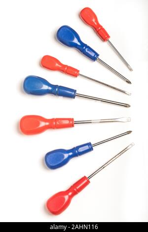 Blue hand screwdrivers and screws isolated on white background. Top ...