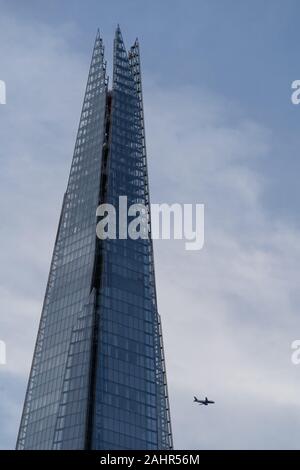 Plane and The Shard at London, London, UK Stock Photo - Alamy