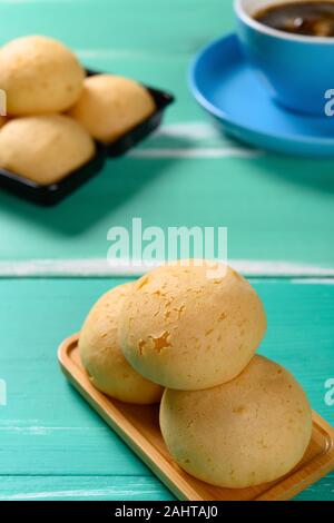 side view sweet puffs and cup of coffee vertical composition Stock ...