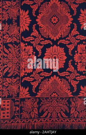 The Craig coverlet, a double Jacquard weaving, features dark blue and ...