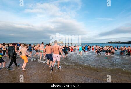 Crowd of People Running out of Water at Beach, on-set of the Film Stock ...