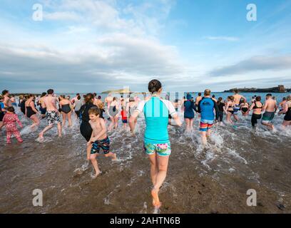 Crowd of People Running out of Water at Beach, on-set of the Film Stock ...