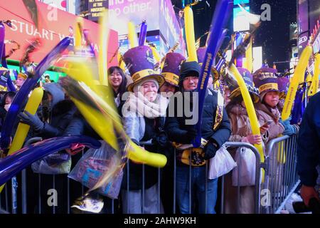 Revelers awaiting the famous drop ball to ring in the new year in Times ...