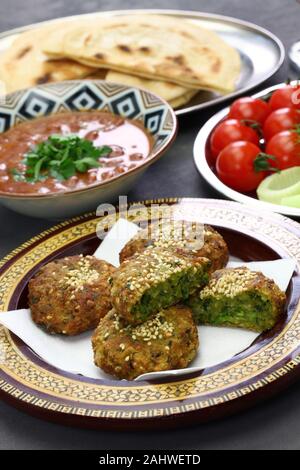 egyptian food (taameya, aish, tahini, ful medames Stock Photo - Alamy