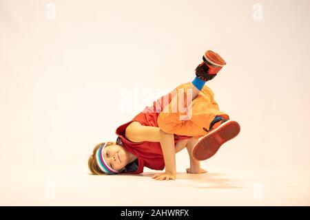 little boy in a unique breakdance position, street dancer, breakdance ...