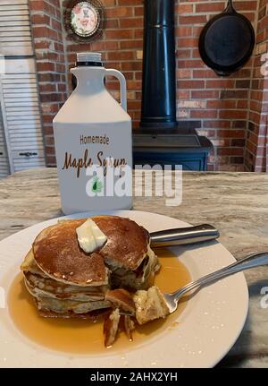 Stack of delicious pancakes on country striped homemade mat background ...