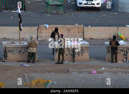 U.S. Marine Corps Sgt. Kyle Carmichael, left, a motor vehicle operator ...