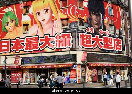 Anime-style billboards and Pachinko E-Space Nittaku sign on building ...