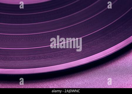 Old colorful Vynil disc playing music, background image Stock Photo - Alamy