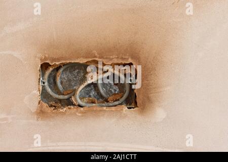 A first fix electrical socket in a freshly plastered wall Stock Photo ...