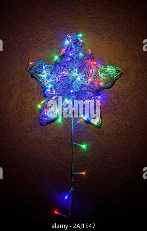 Flat lay with Xmas decorations in green and red with frosted berries ...