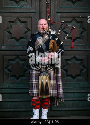 Bagpipe player busker wearing kilt and dress uniform, Royal Mile ...
