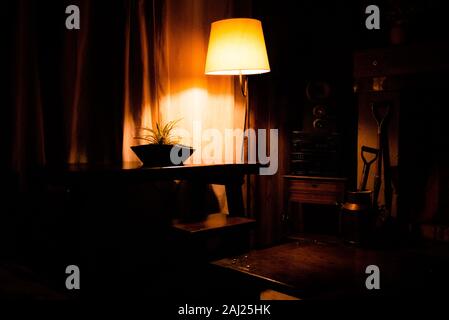 Living room and dining room with dimly lit lights Stock Photo - Alamy