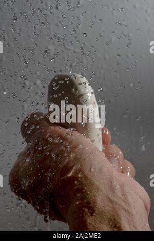 Soap in human hands and falling water Stock Photo - Alamy